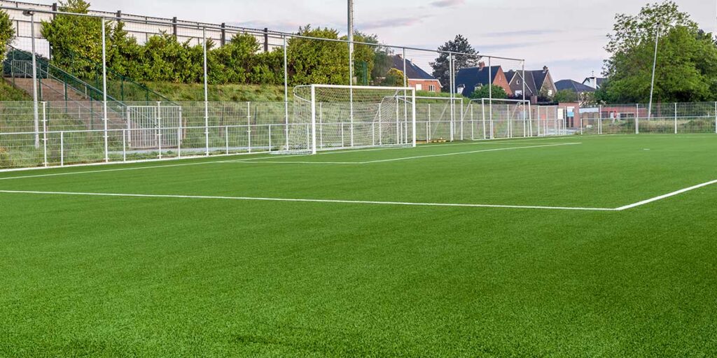 Football Field Construction with Artificial Grass